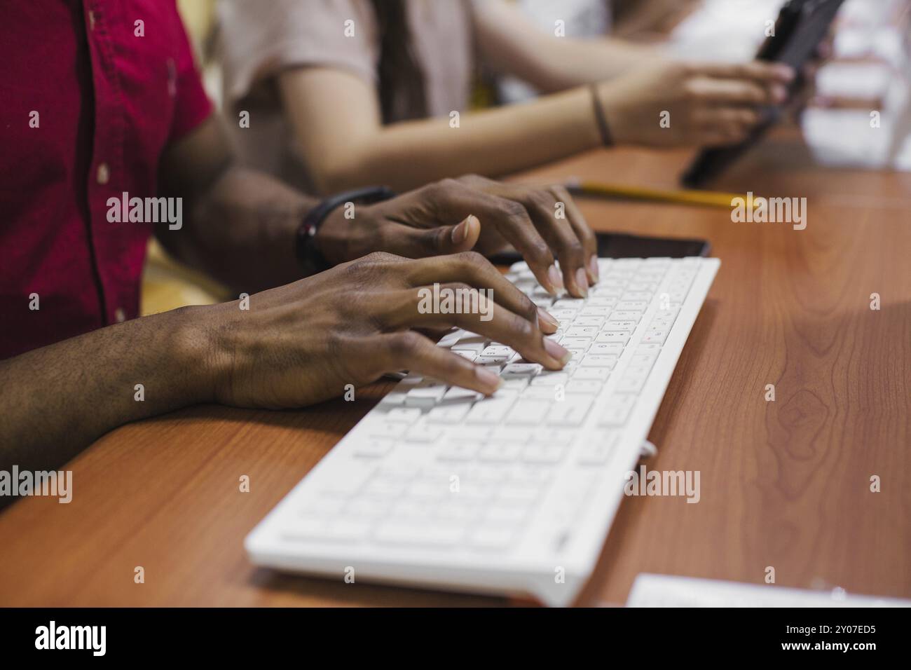 Anonymous black man typing Stock Photo - Alamy