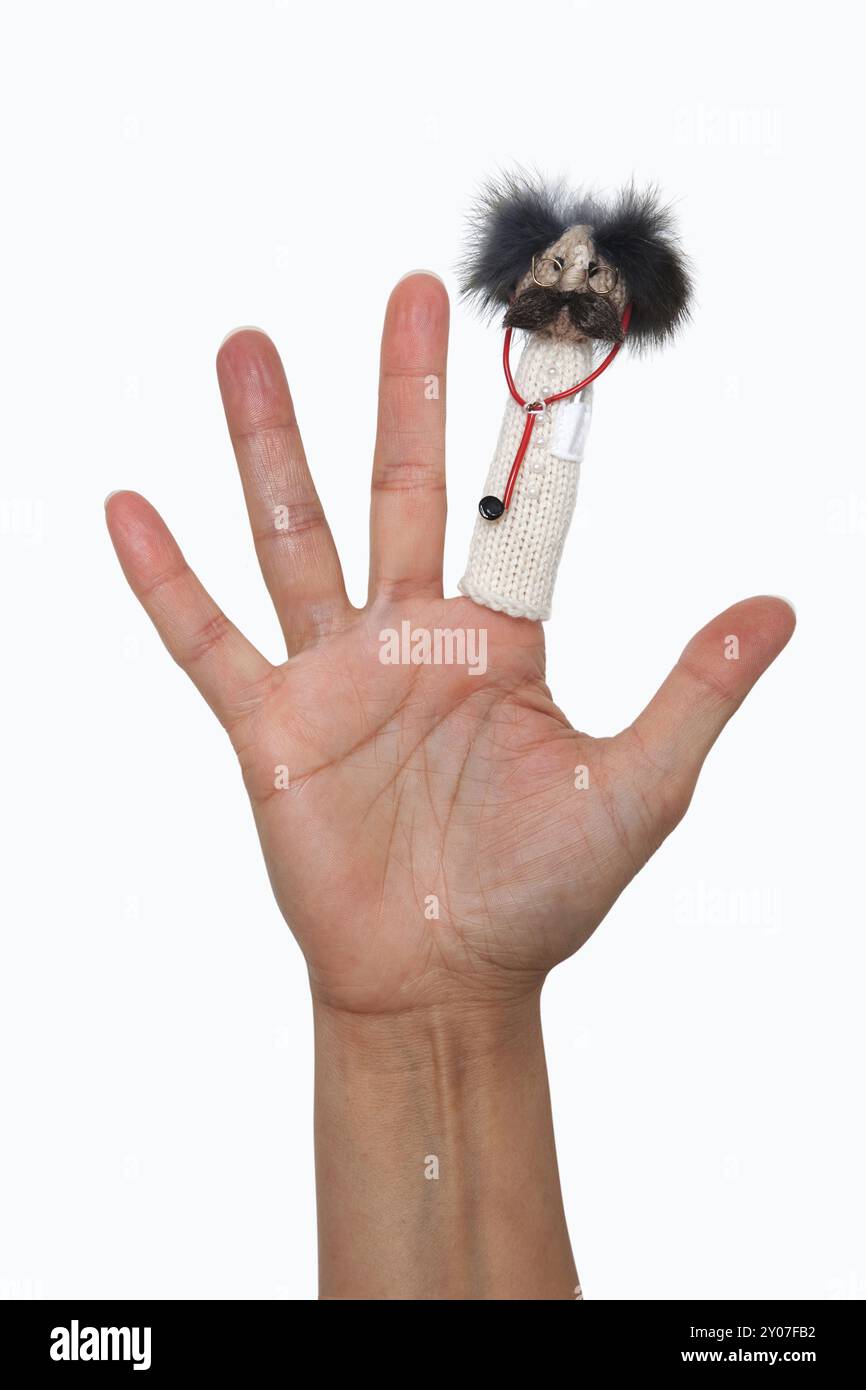 Finger puppet with a doctor Stock Photo - Alamy