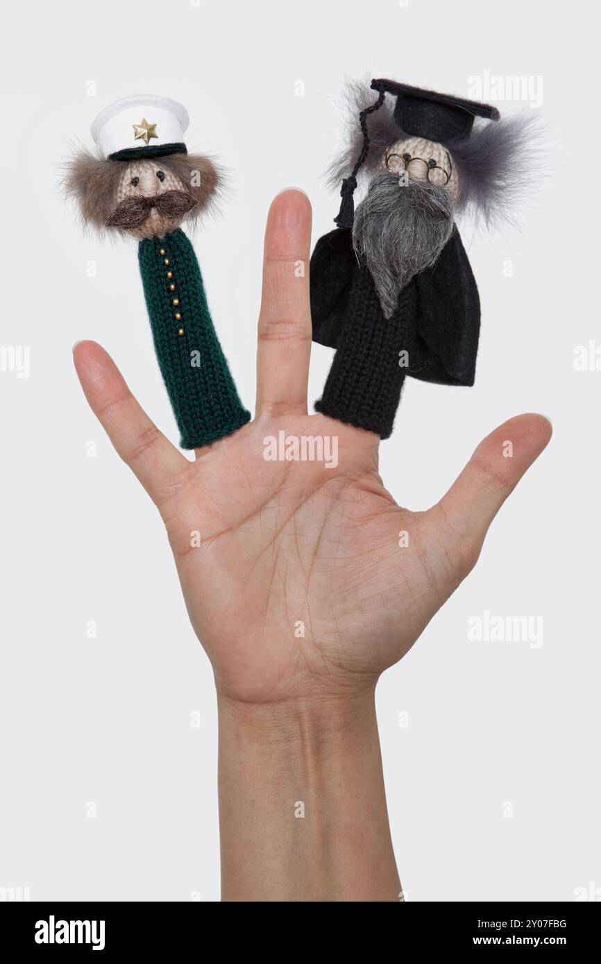 Finger puppet with police and judge Stock Photo - Alamy