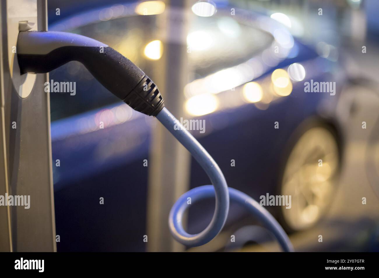 Electric car recharging with charge cable and plug leading to charge ...