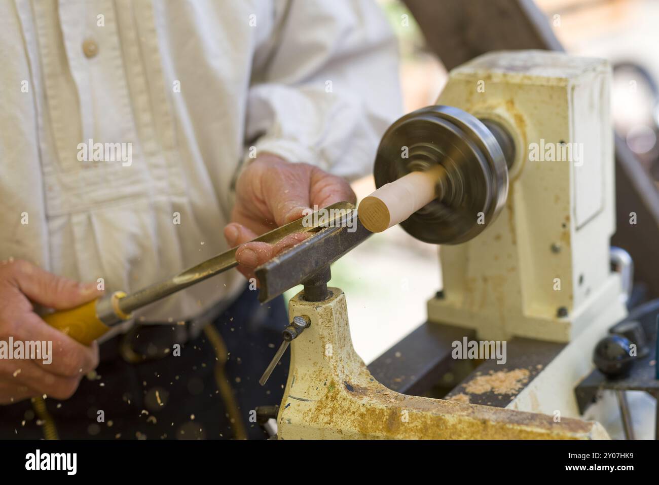 Wood turner working a piece of wood Stock Photo - Alamy