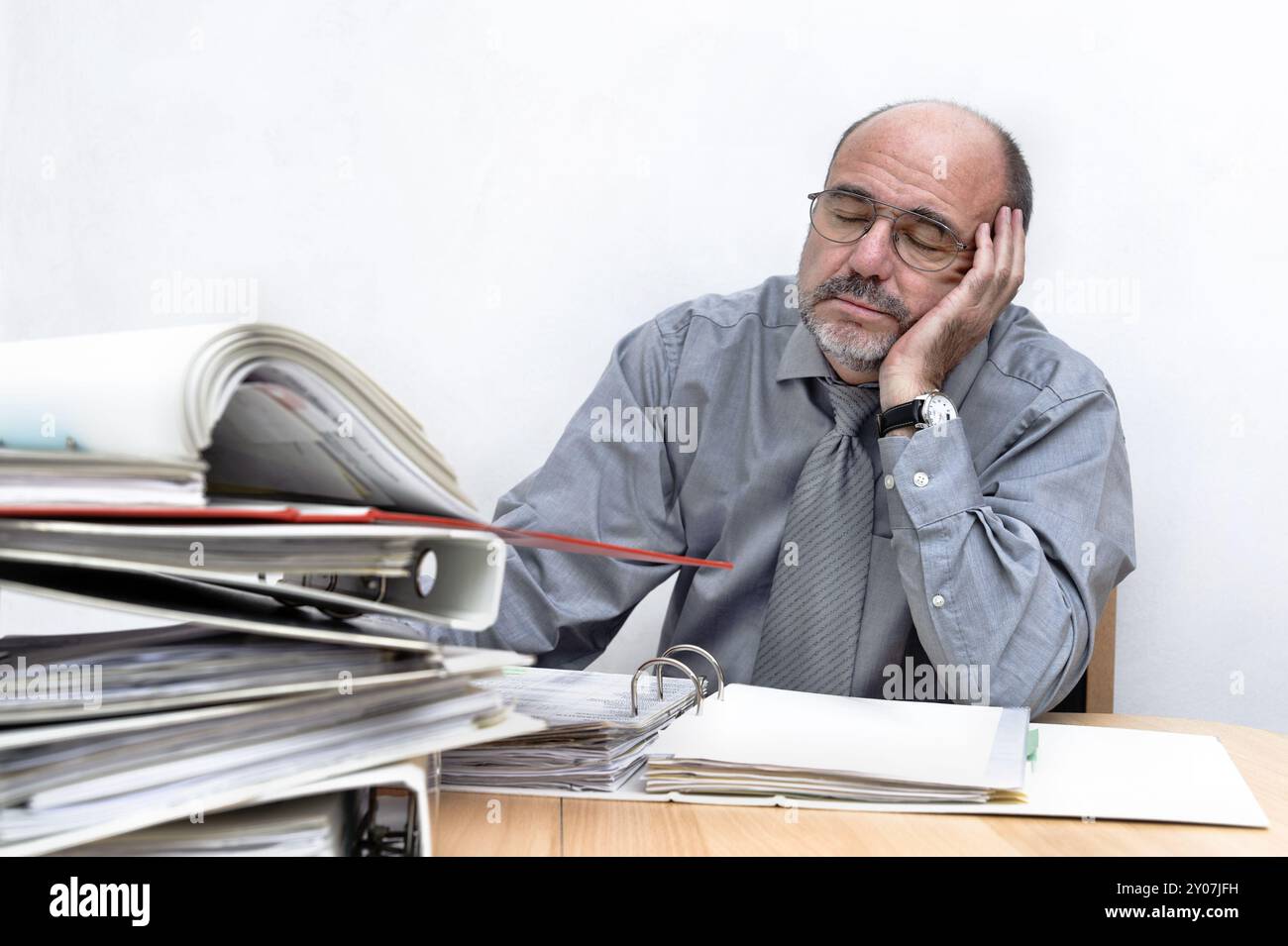 Man behind stack papers hi-res stock photography and images - Alamy