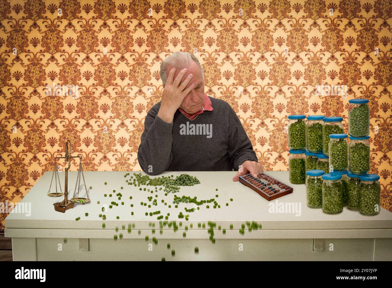 Man with a calculator counts the peas Stock Photo - Alamy