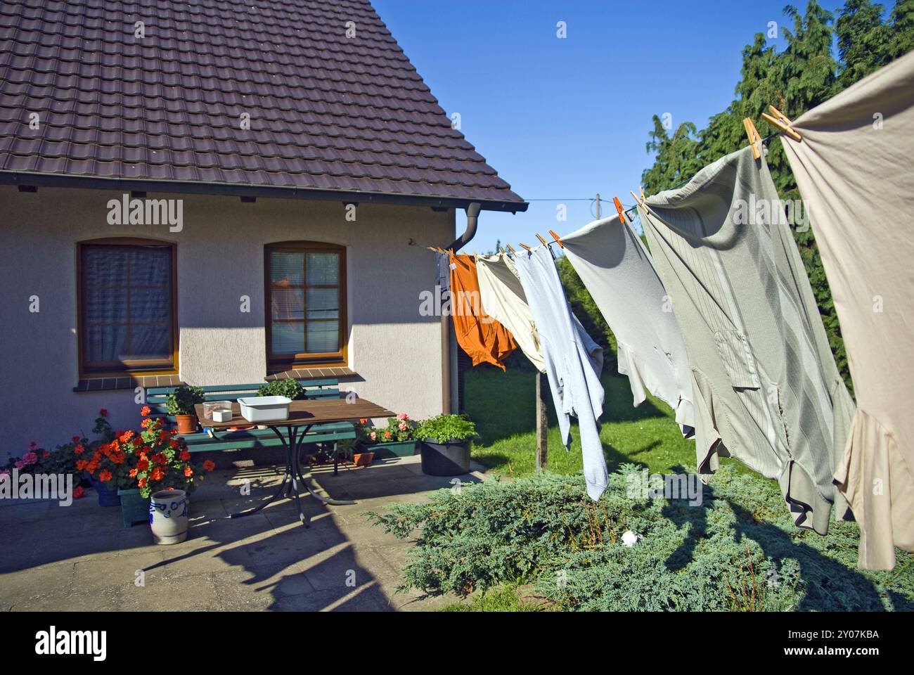 House and yard with washing line Stock Photo - Alamy