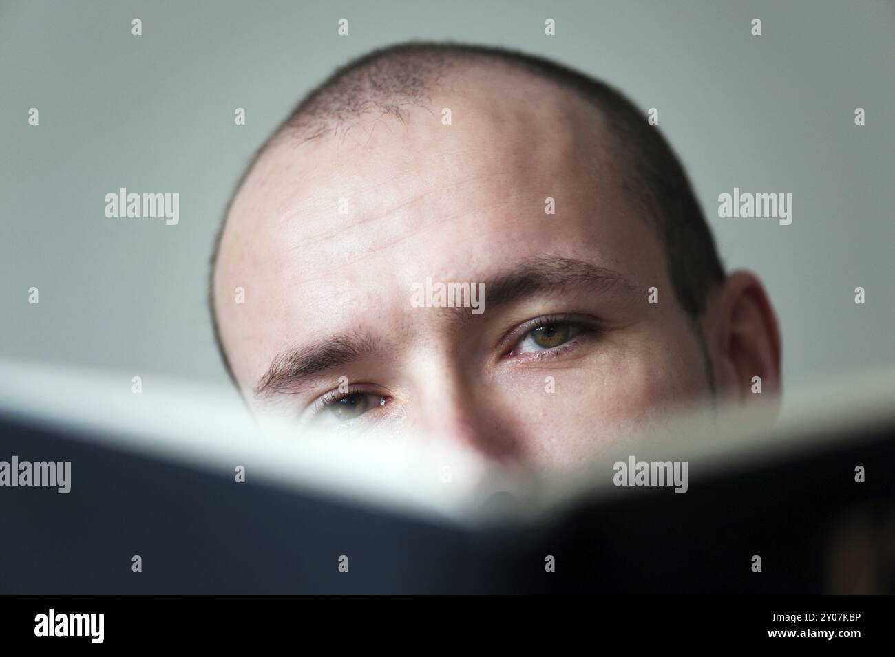 Guy looks book hi-res stock photography and images - Alamy