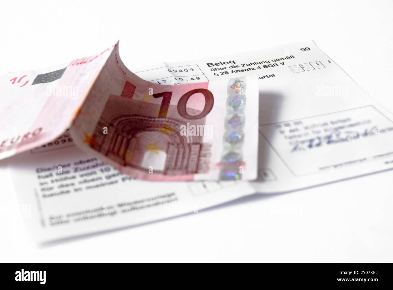 Receipt for payment of the practice fee and 10 euro note Stock Photo ...