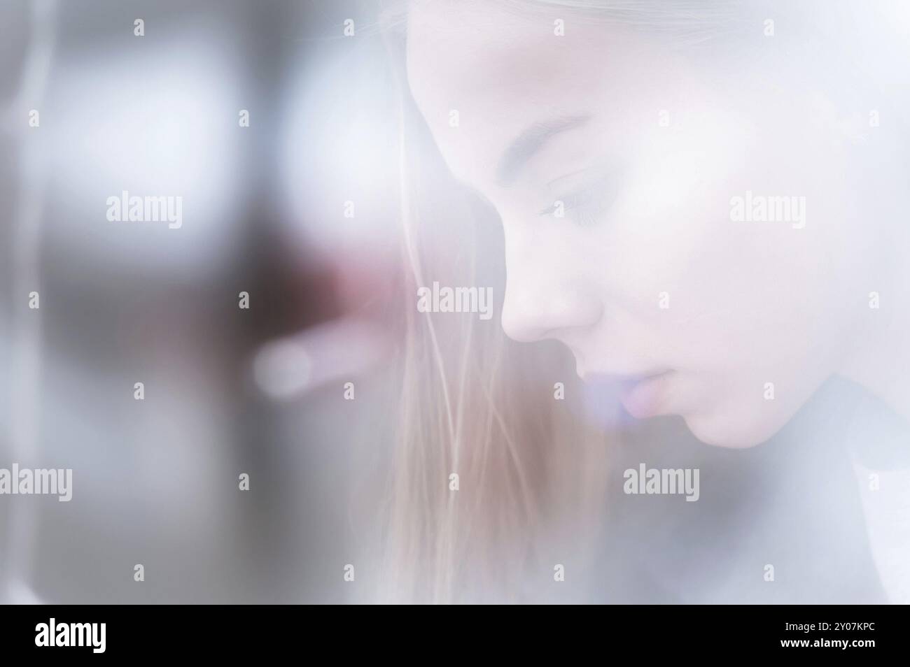 Portrait of an attractive young girl. Non-contrast view through window ...