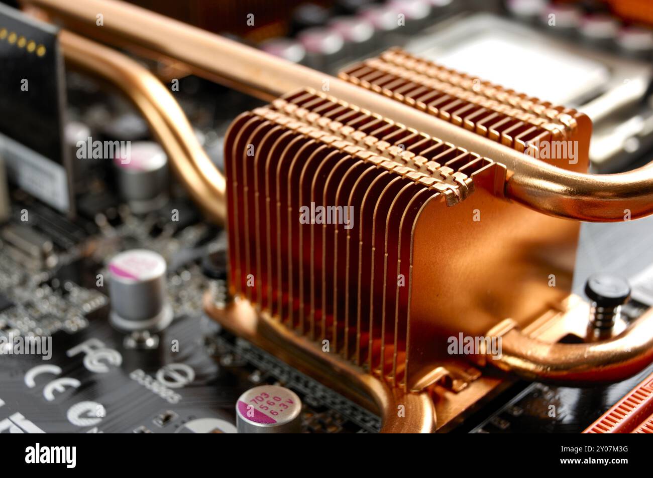 Copper heatsink radiator cooler on a computer motherboard Stock Photo ...