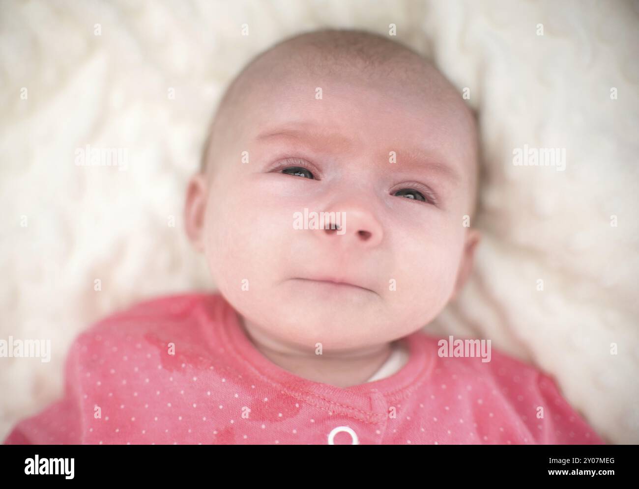 Newborn with very sad face start to cry. Baby healtcare Stock Photo - Alamy