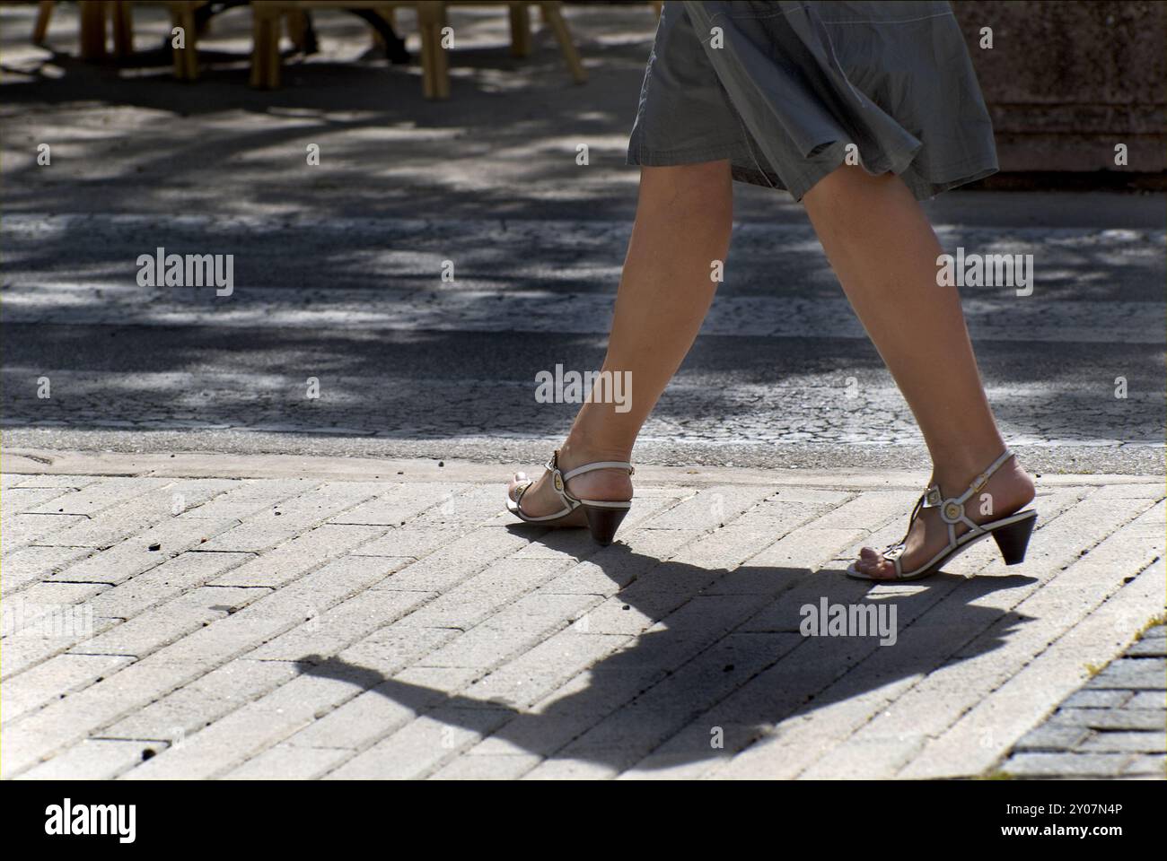Women's legs while walking Stock Photo - Alamy