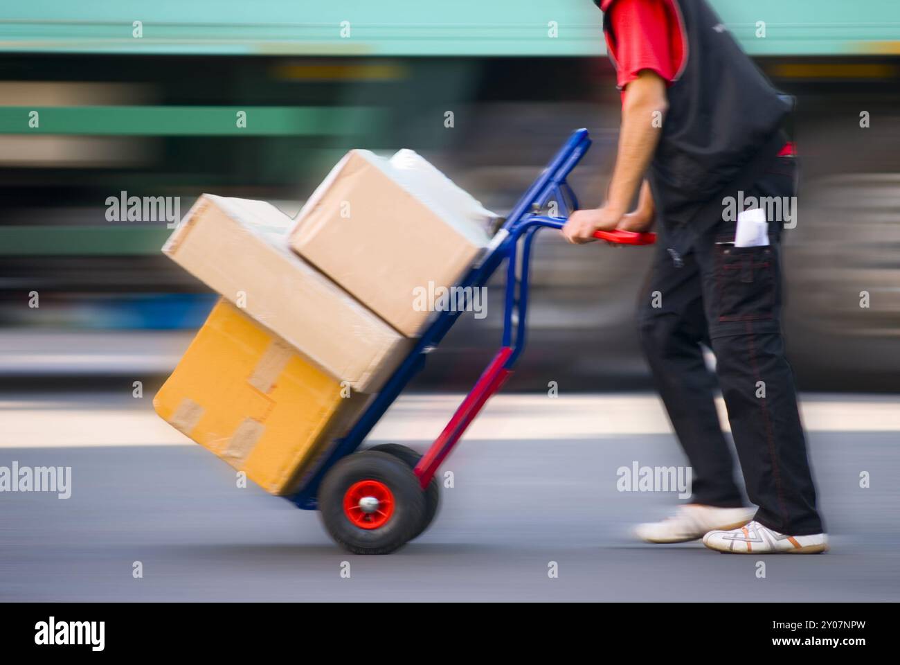 Parcel carrier with trolley Stock Photo - Alamy