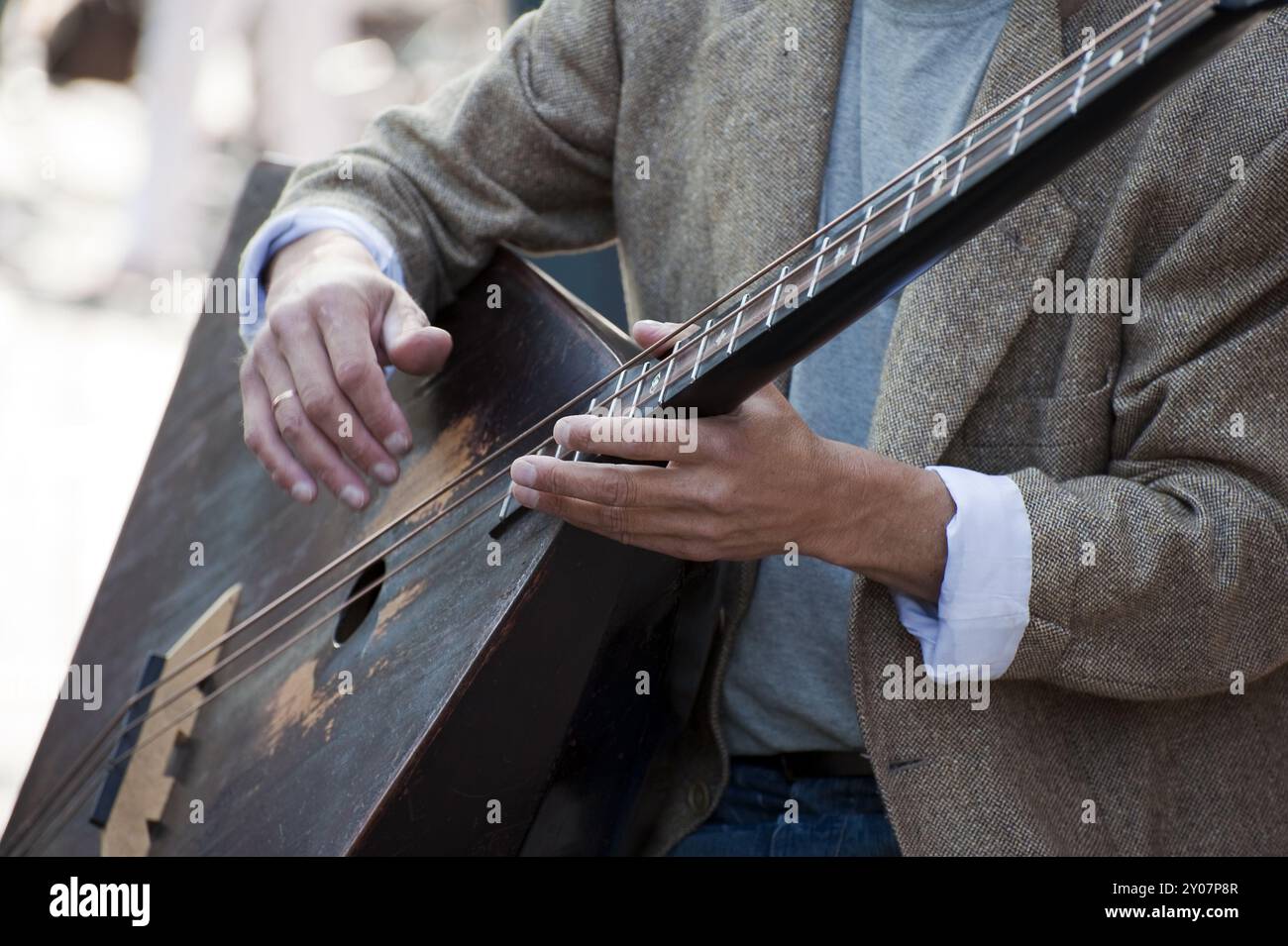 Hands of a balalaika player on his balalaika Stock Photo - Alamy