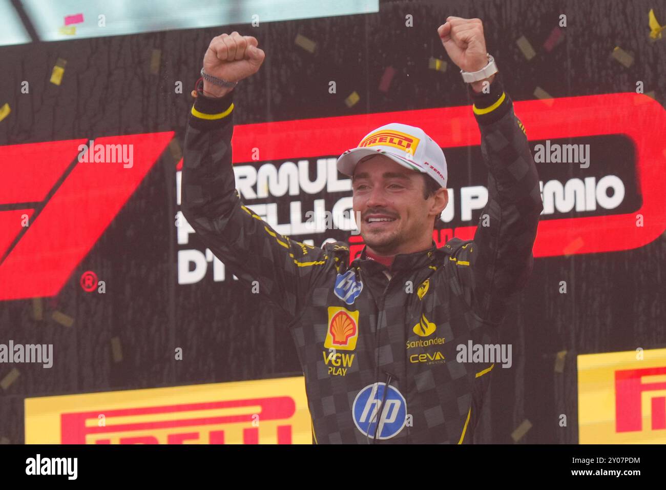 Ferrari driver Charles Leclerc of Monaco celebrates on the podium after ...