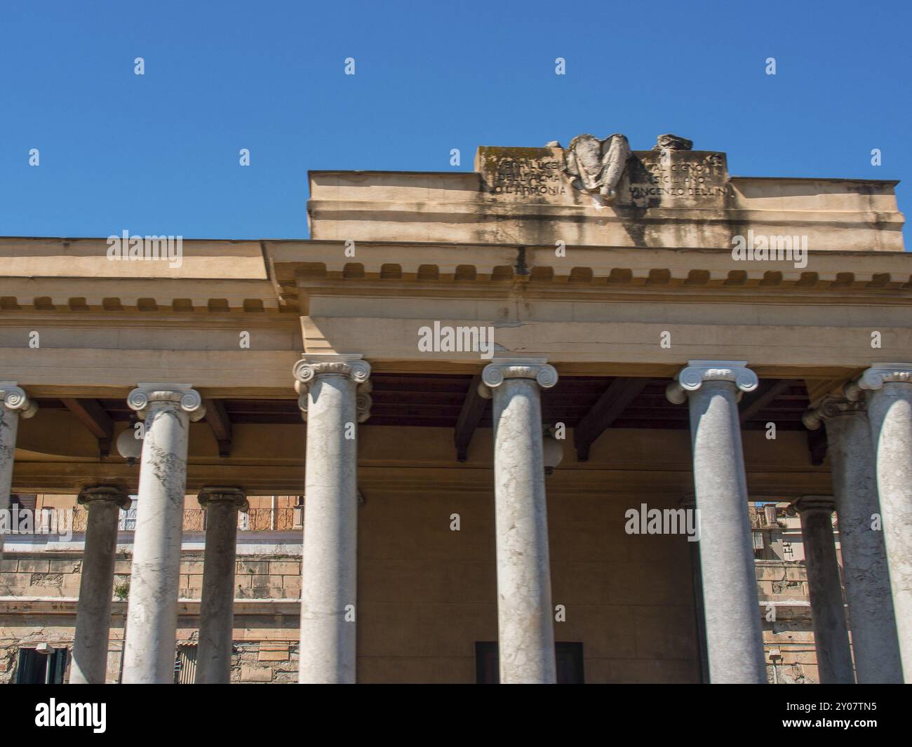 Historic building with large columns and ornate details under a blue ...