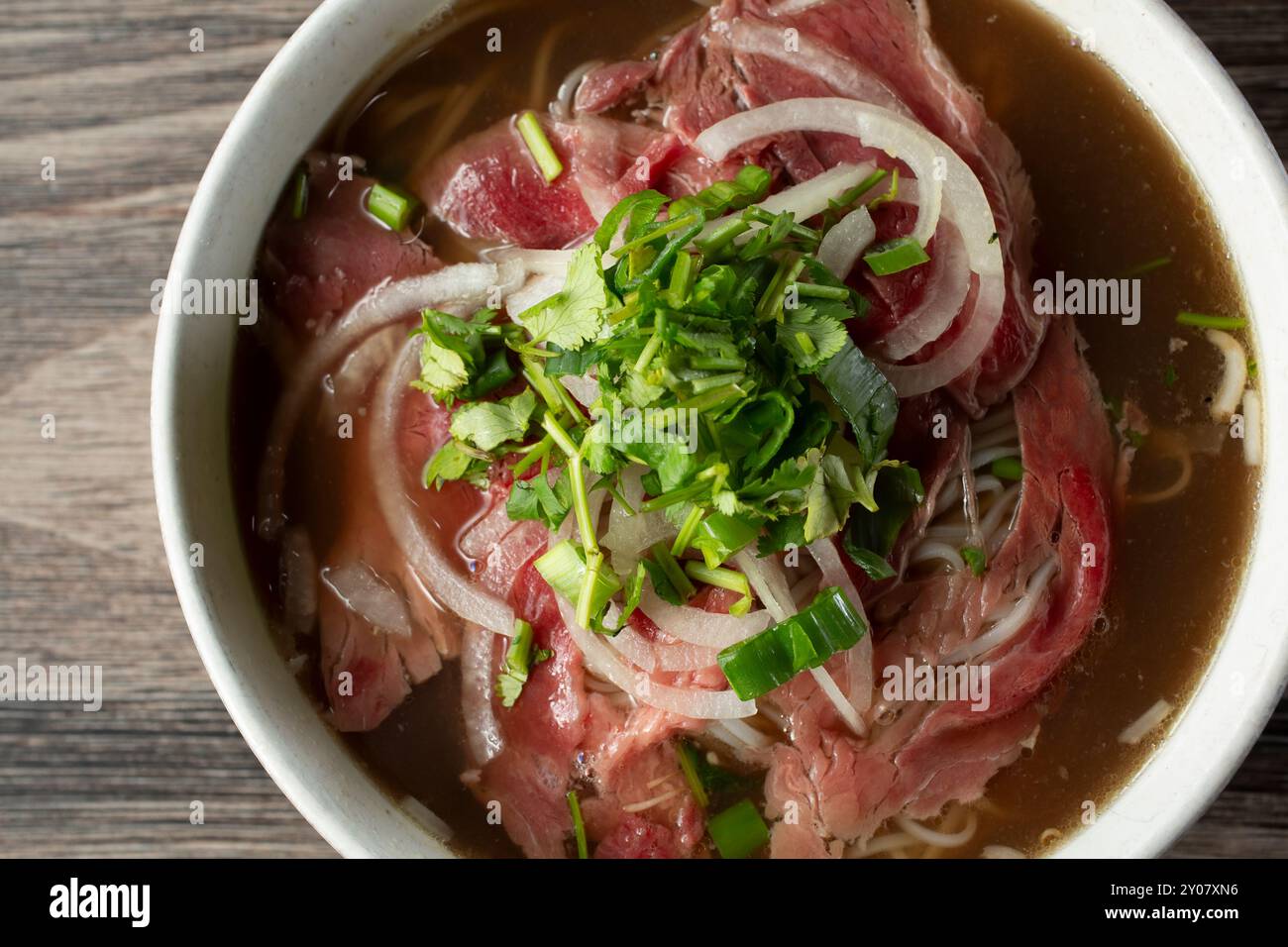 A top down view of a bowl of rare wagyu beef pho Stock Photo - Alamy
