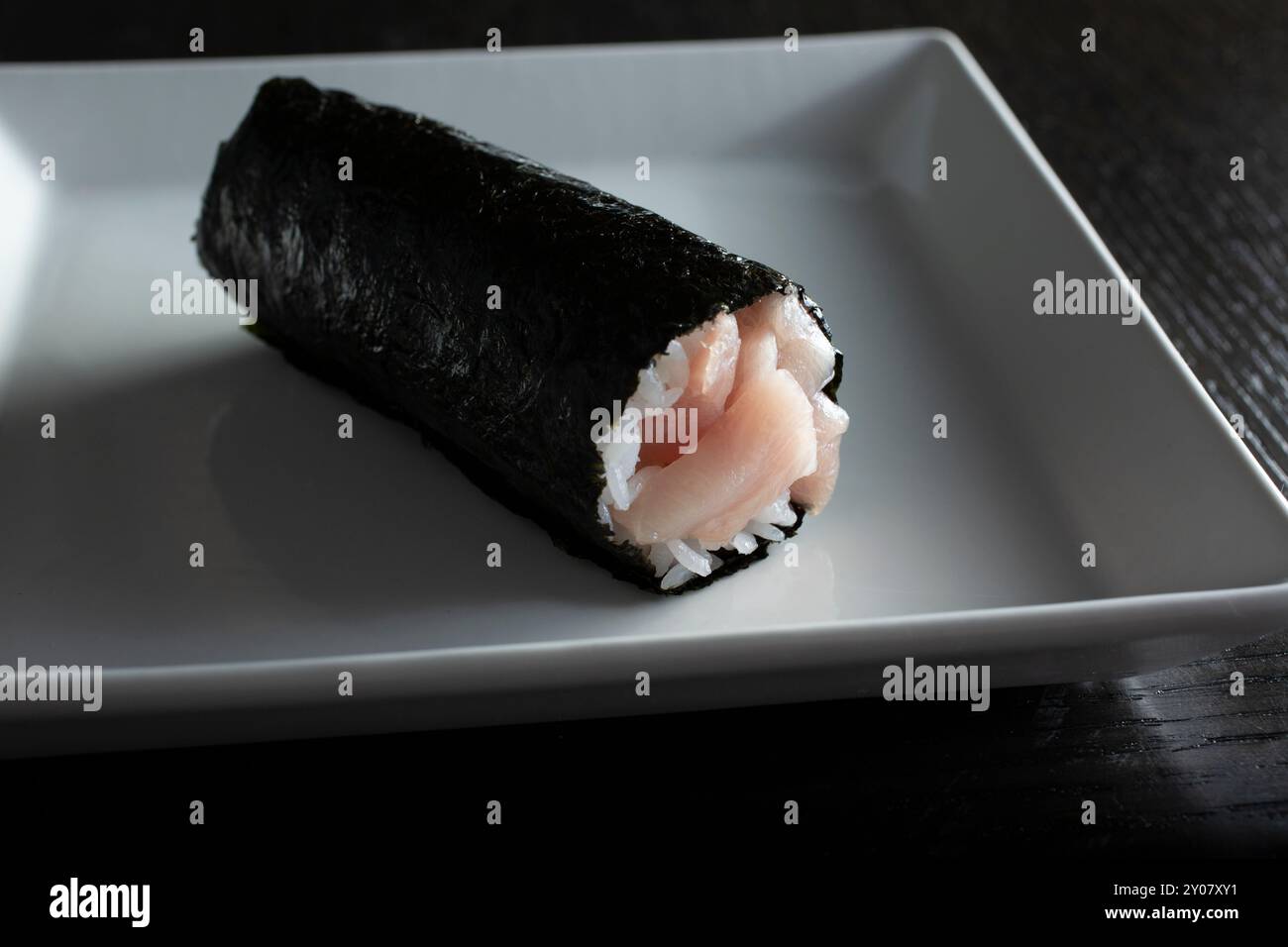 A closeup view yellowtail hand roll Stock Photo - Alamy