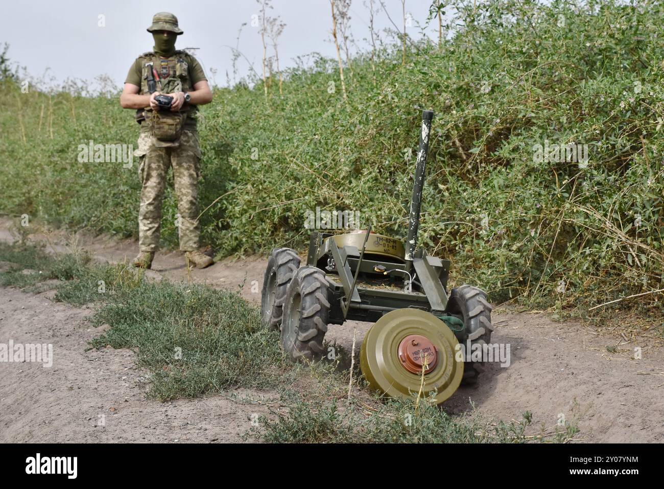 A Ukrainian serviceman of 65th Separate Mechanised brigade operates a ...