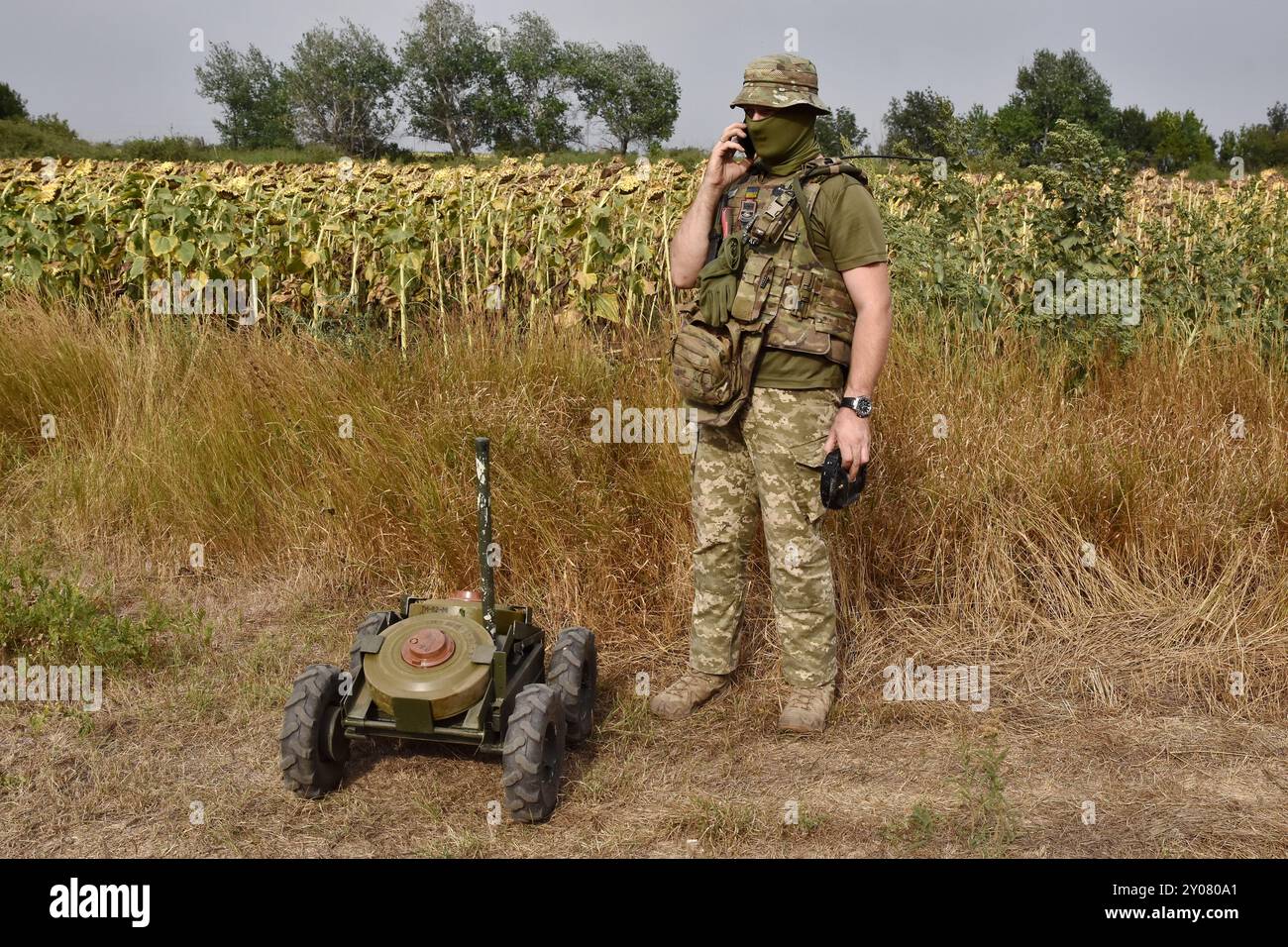 A Ukrainian serviceman of 65th Separate Mechanised brigade stands by ...