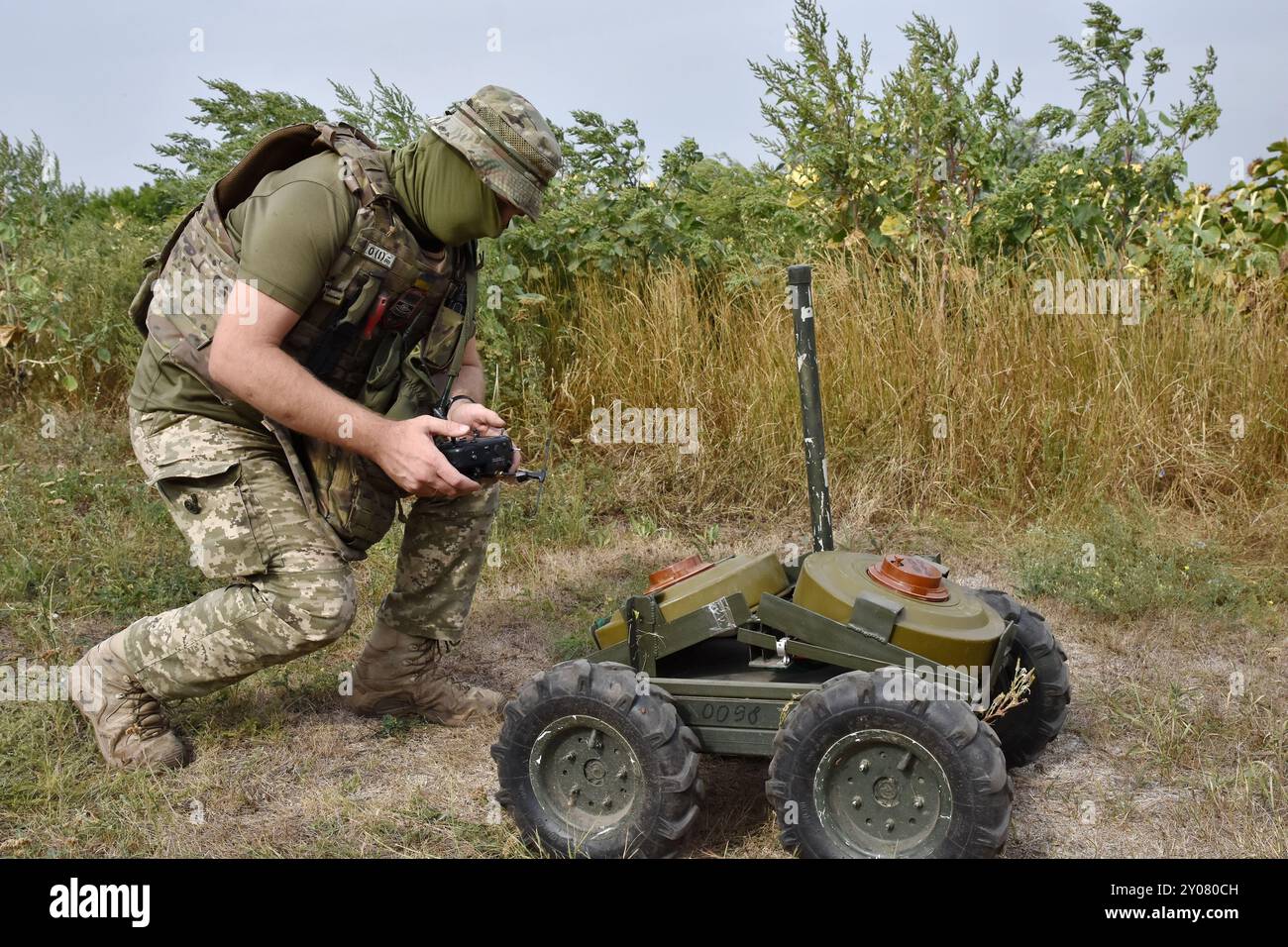 A Ukrainian serviceman of 65th Separate Mechanised brigade operates a ...
