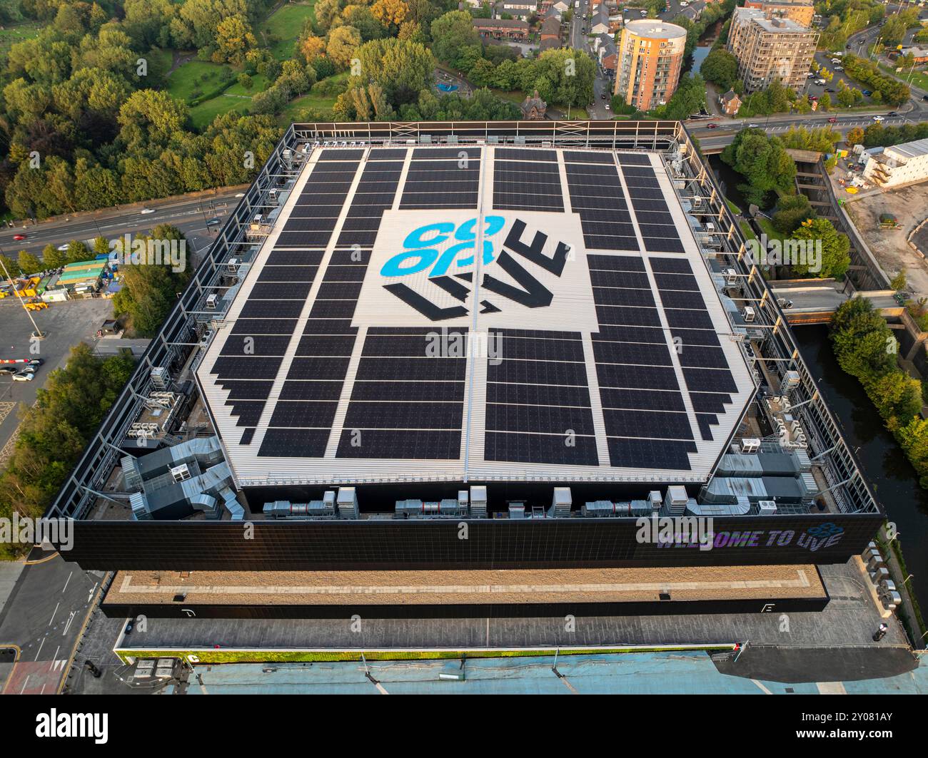 An aerial view of CO-OP LIVE building with a flat roof and a "COOP LIVE ...