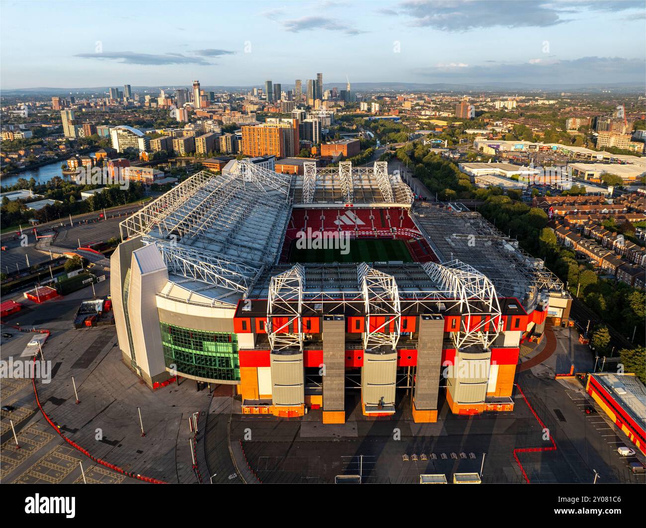Old Trafford (Manchester United) stadium at sunset with the Manchester ...