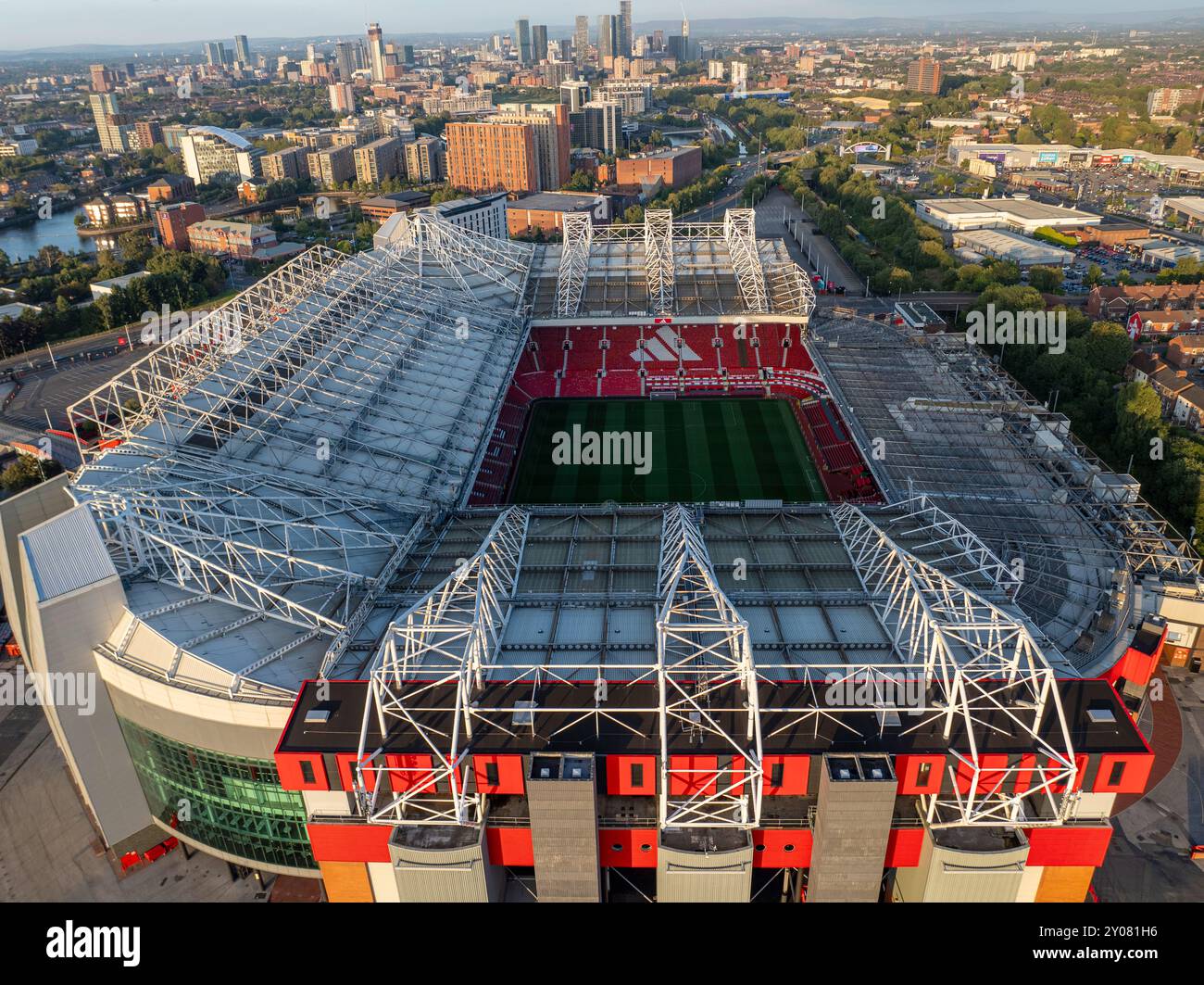 Old Trafford (Manchester United) stadium at sunset with the Manchester ...