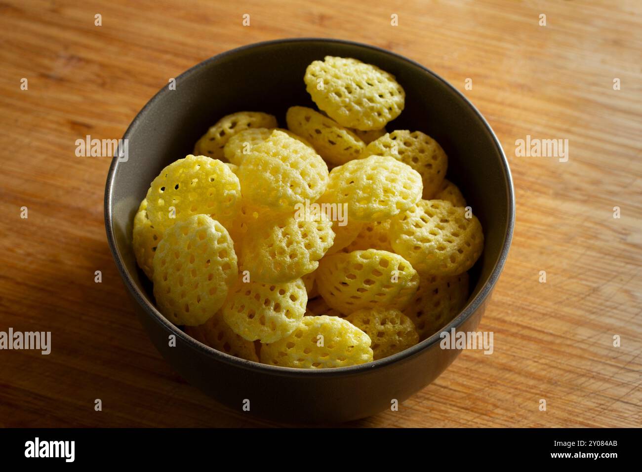 A view of a bowl of puffy air potato chips Stock Photo - Alamy