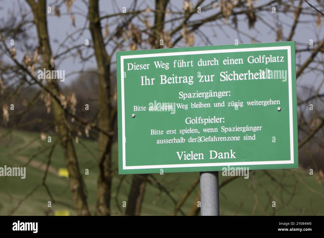 Warning sign golf course Stock Photo - Alamy