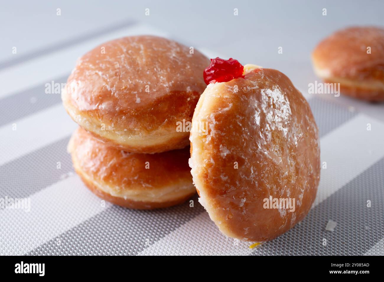 A view of some glazed jelly filled donuts Stock Photo - Alamy