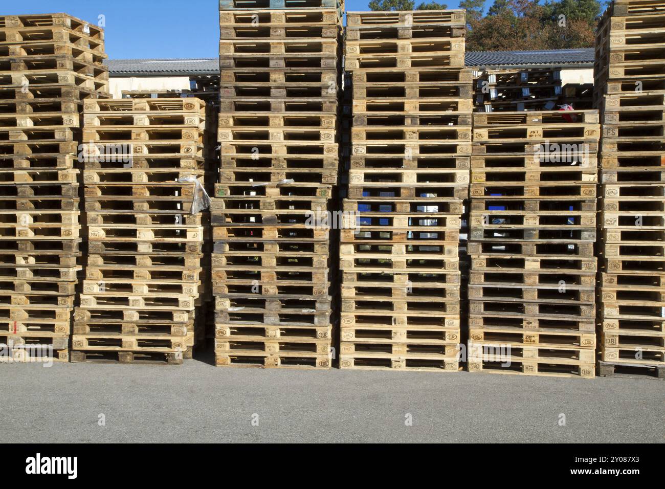 Pallets stacked on top of each other Stock Photo - Alamy