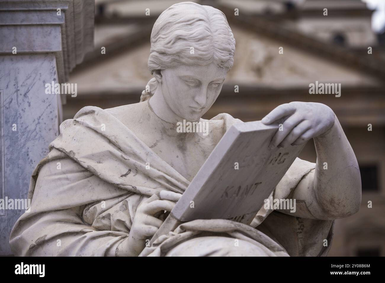 Statue of a reading scholar Stock Photo - Alamy