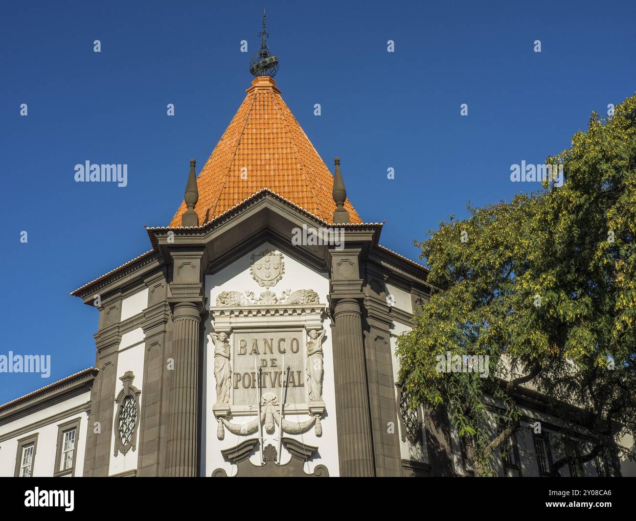 Historic facade of the Banco de Portugal building with brick tower ...