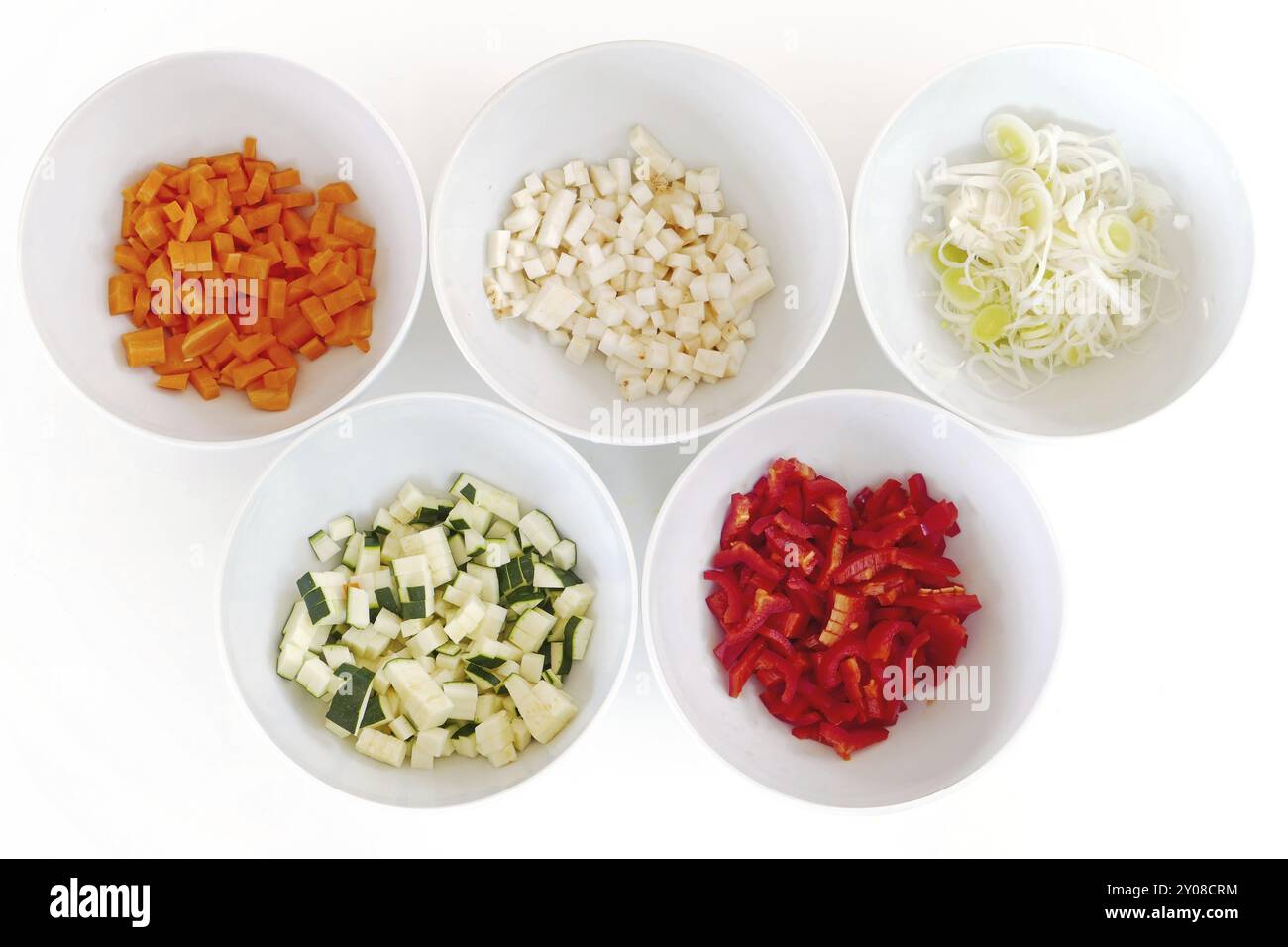 Different kinds of chopped vegetables in white bowls, cooking ...