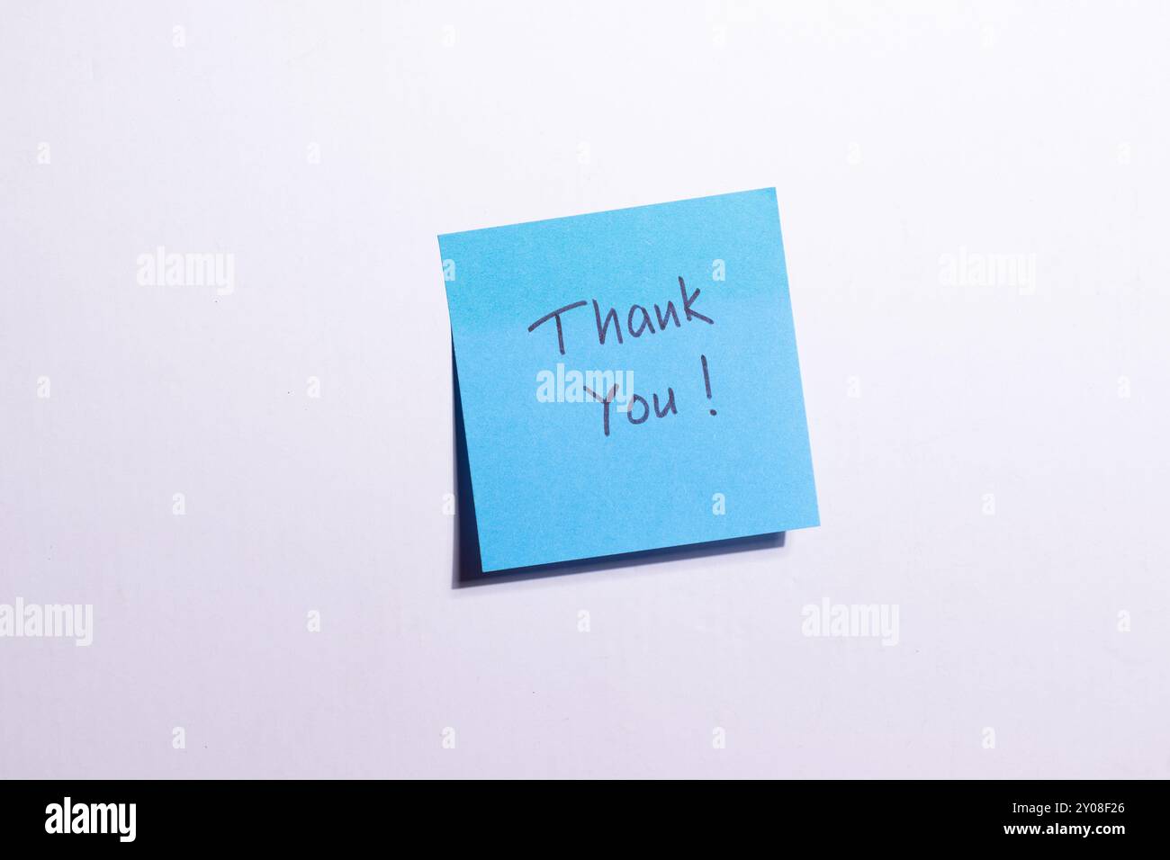 A blue sticky note showing thank you on white background Stock Photo ...