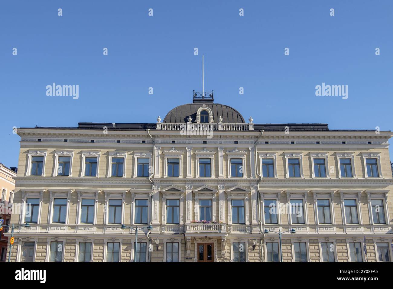 Historic building with many windows and architectural details under a ...