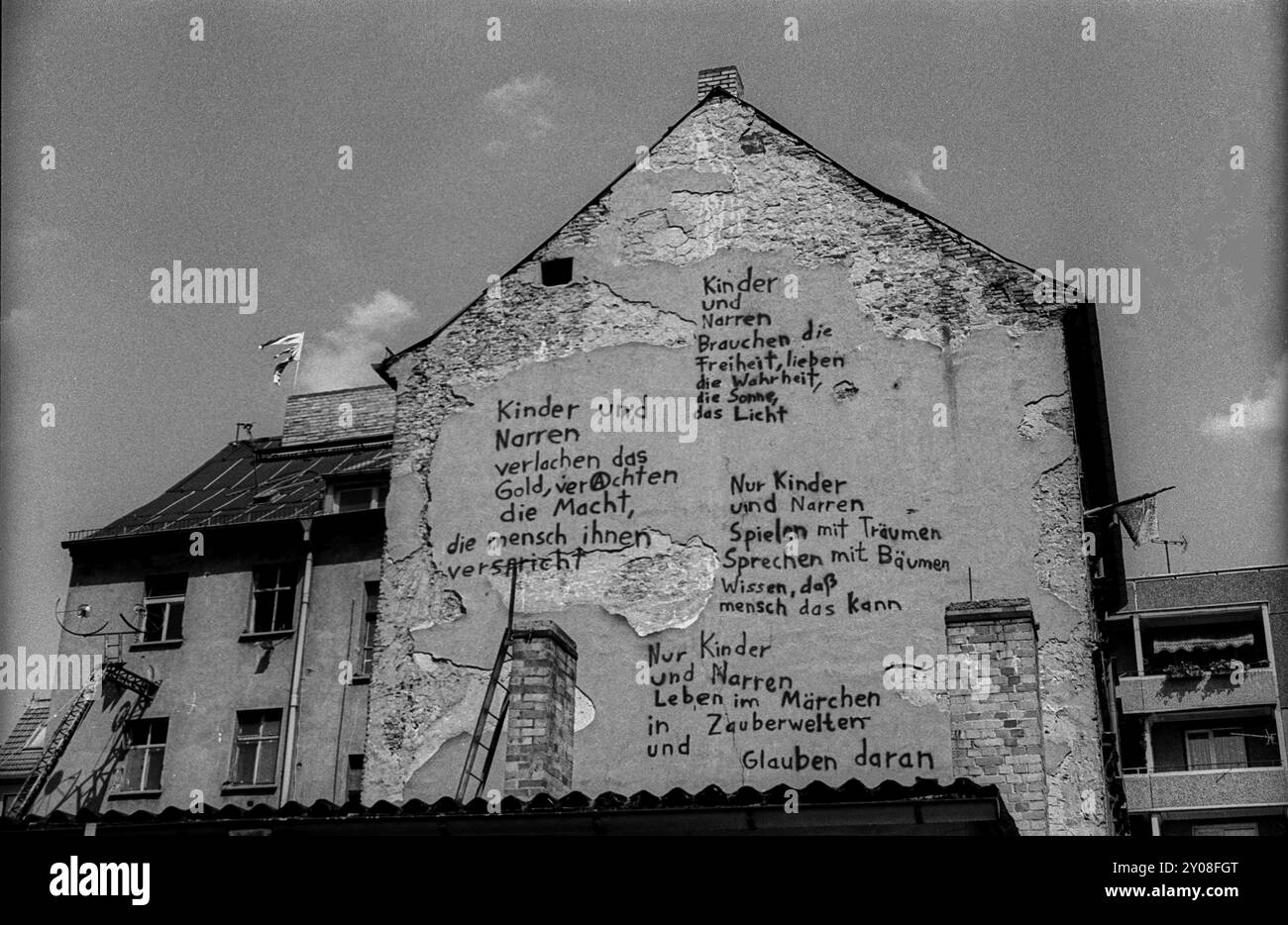Germany, Berlin, 1 July 1991, Poem on the gable of a squatted house in ...