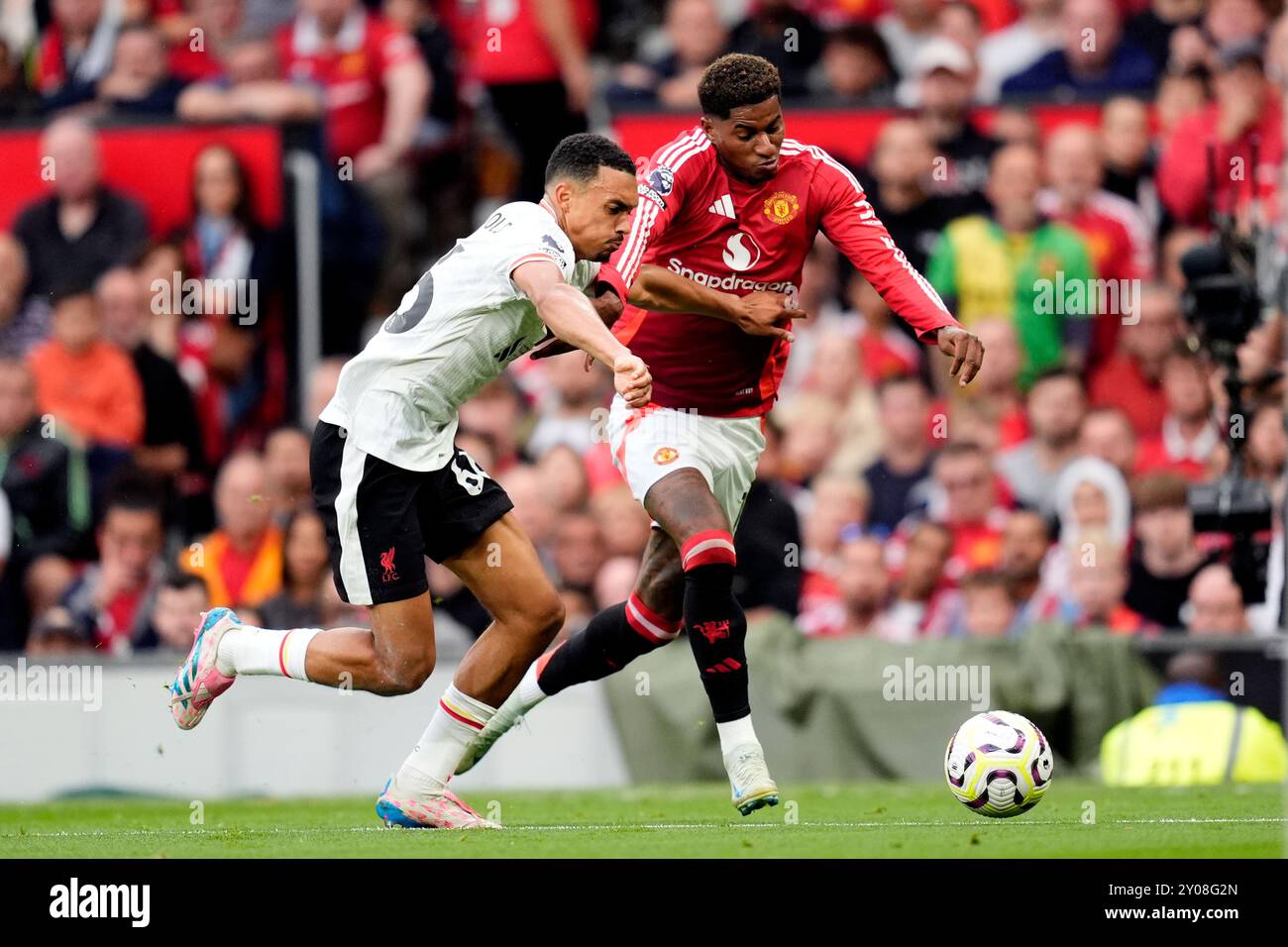Manchester United's Marcus Rashford, (right) battles for possession of ...
