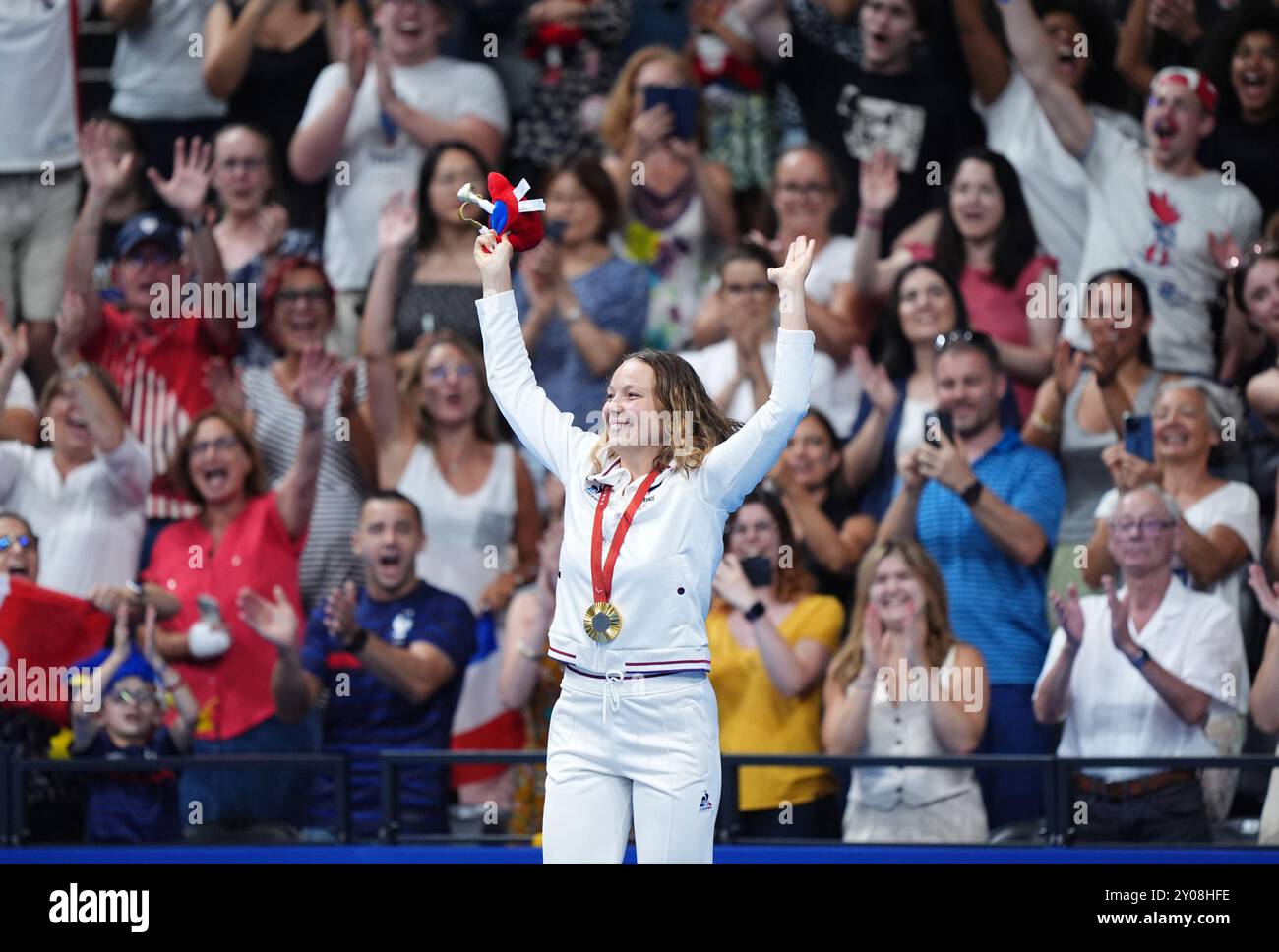 France's Emeline Pierre celebrates with her gold medal after winning ...