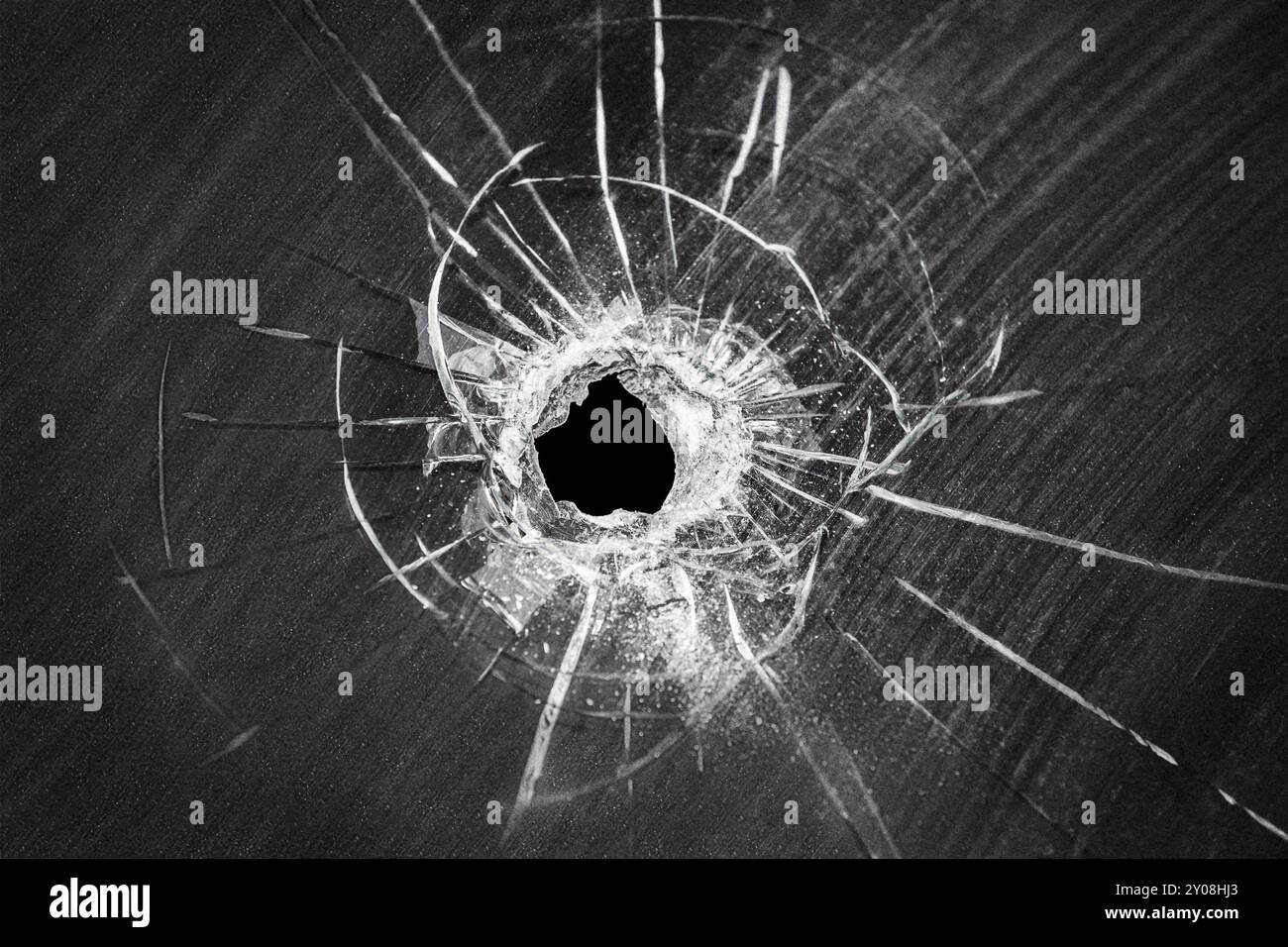 Bullet shot cracked hole on car windshield or accident damaged broken ...