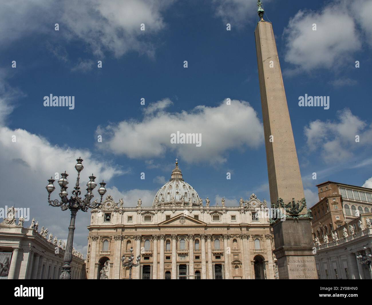 Historic church with a large obelisk surrounded by sculptures and ...