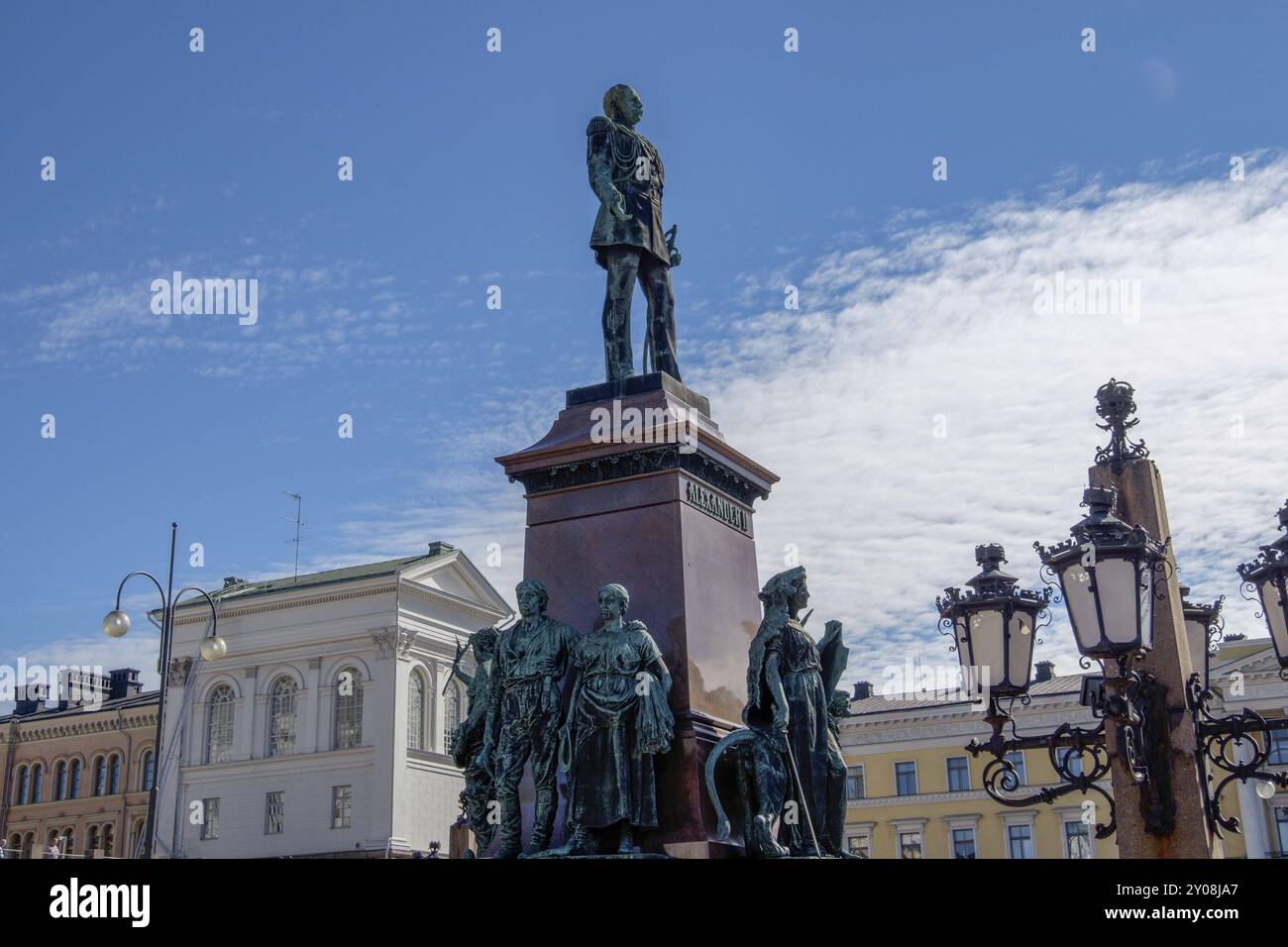 Statue of historical figures in front of classical buildings and ...