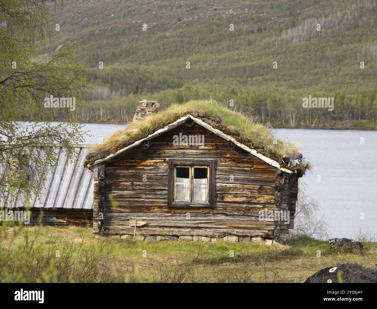 Holiday home at edge of a lake, built partially in the style of the ...