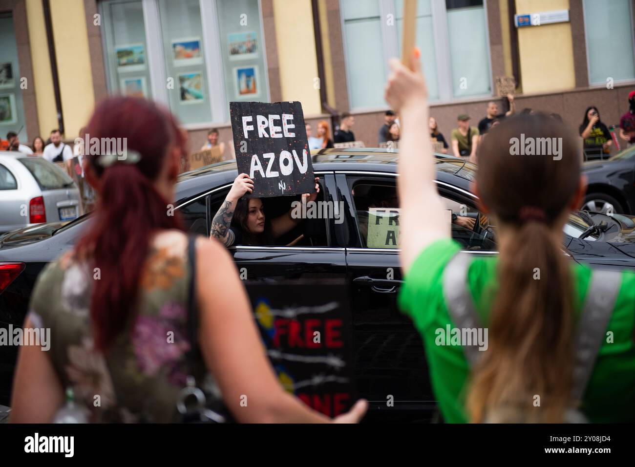 Kyiv, Ukraine. September 1st 2024, Kyiv, Ukraine. A car drives past a rally of supporters of ...