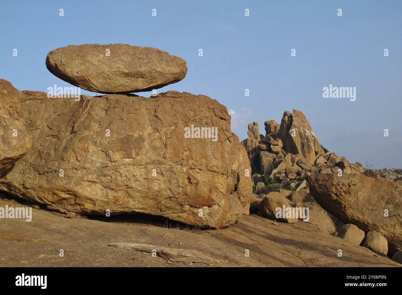 Big balancing granite boulder and mountain in Hampi, India. Travel ...