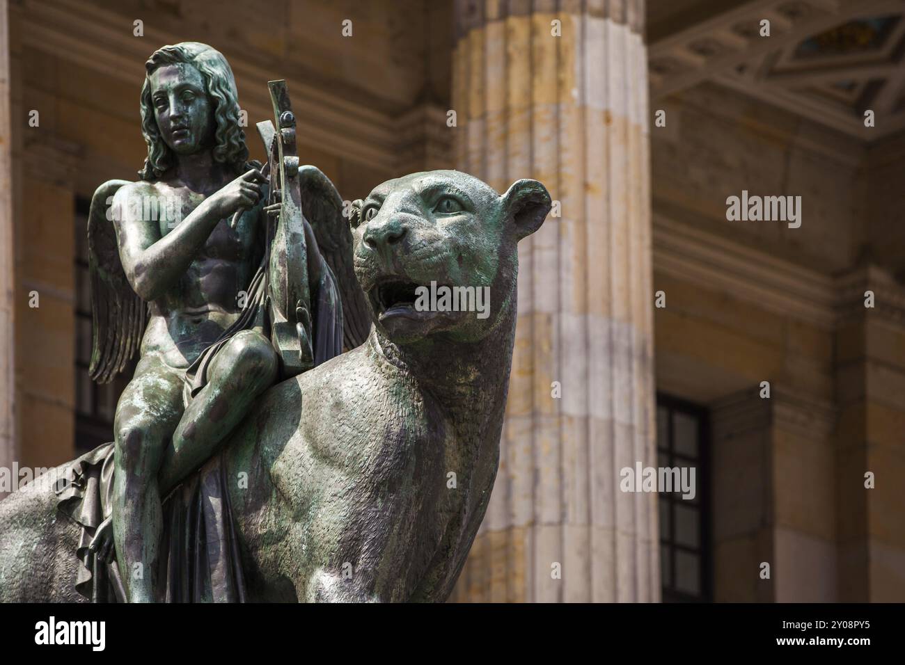 Close-up of an angel riding a lioness and playing the harp, with the ...
