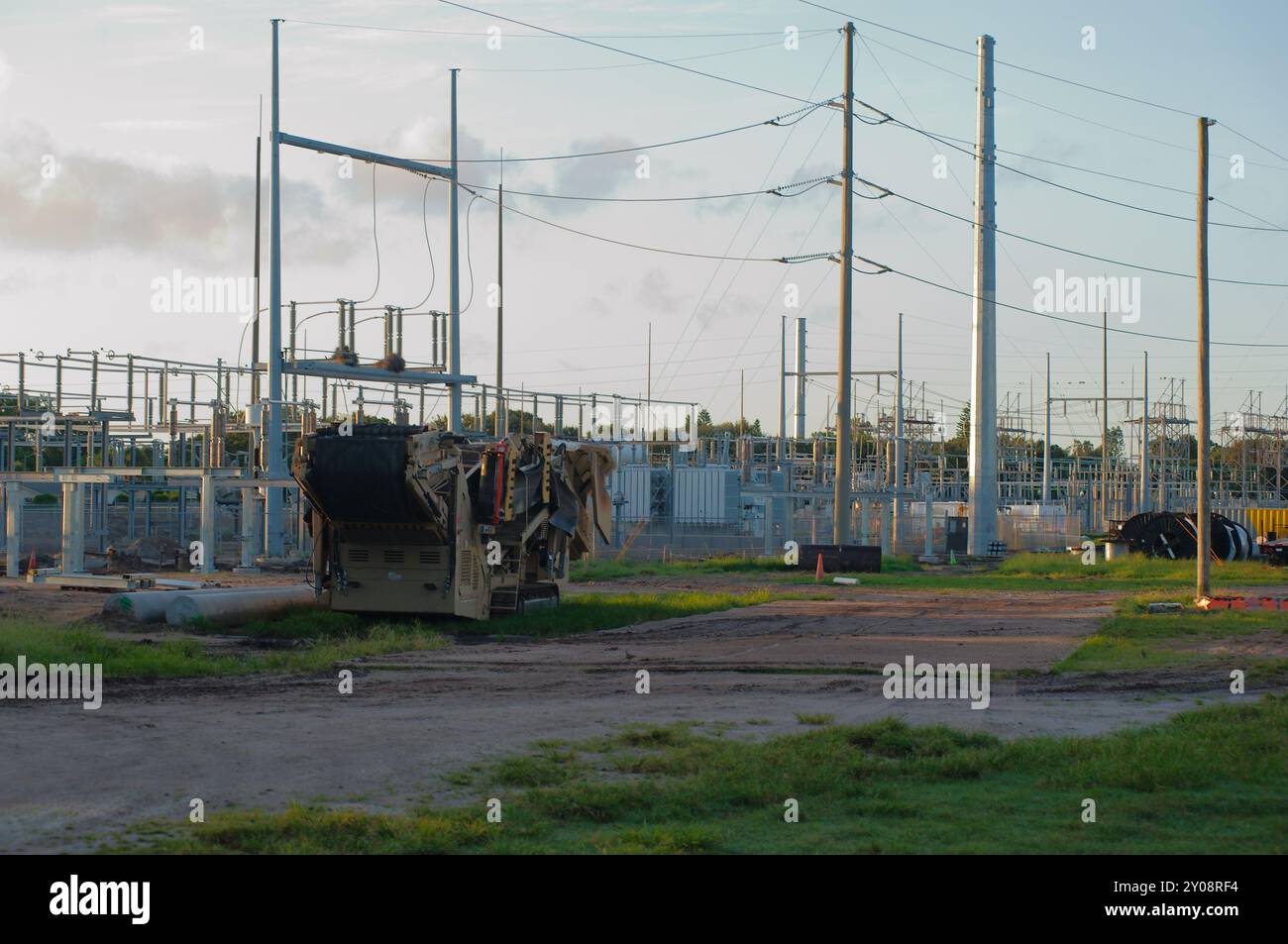 Wide view near sunset of Electric Substation with High Power Lines in ...