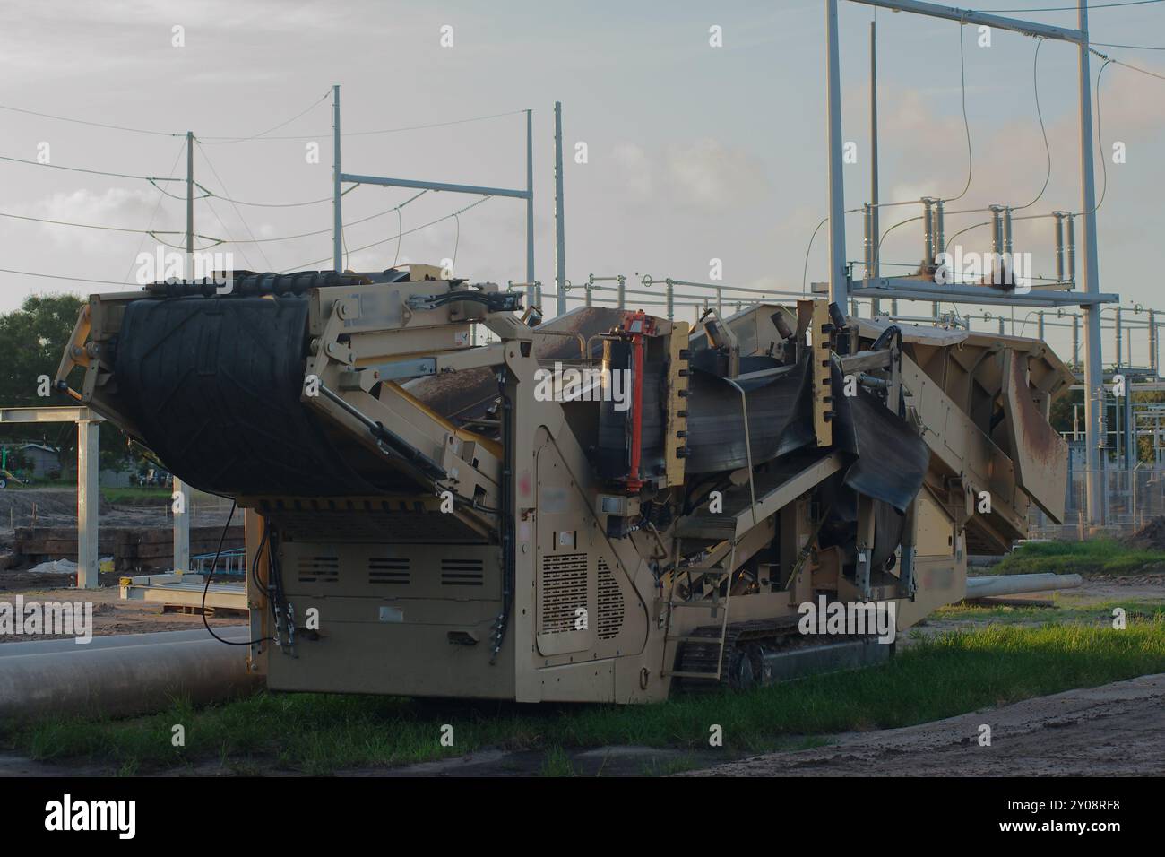 Wide side view near sunset large Construction Conveyor Feeder Stacker ...