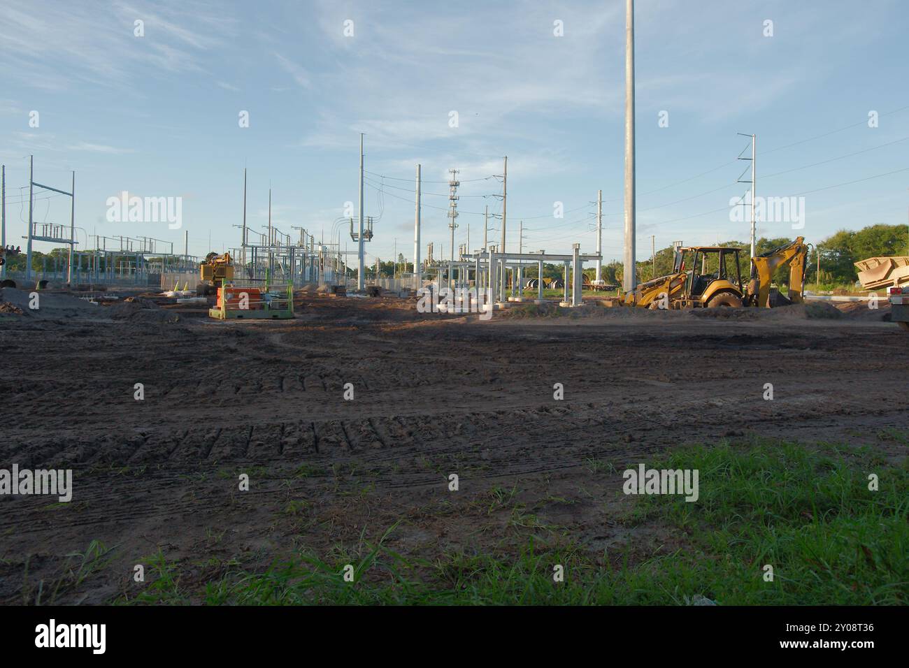Wide view near sunset of Electric Substation with High Power Lines in ...