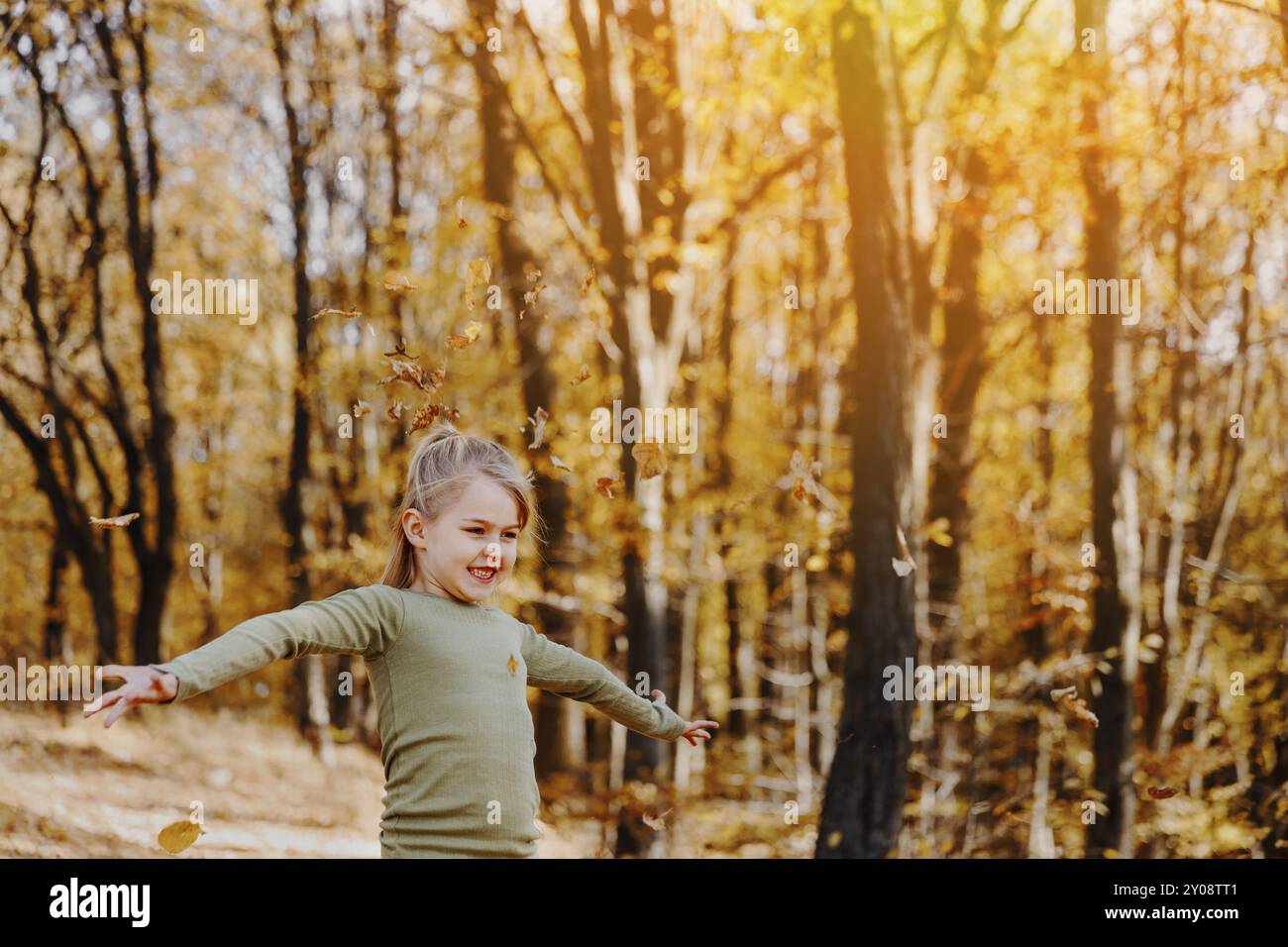 Small happy smiling little caucasian child girl playing with yellow ...