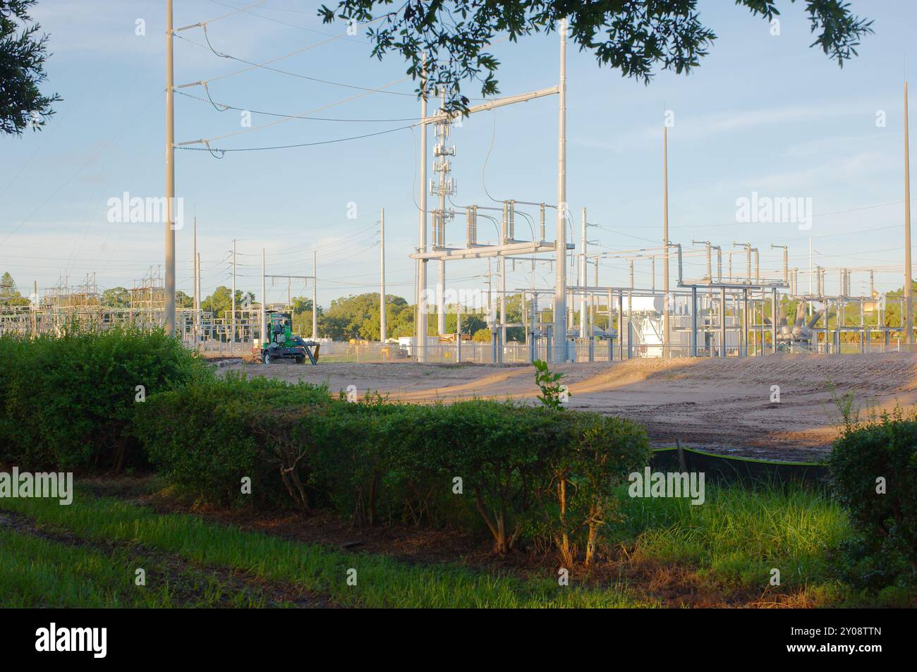 Wide view near sunset of Electric Substation with High Power Lines in ...